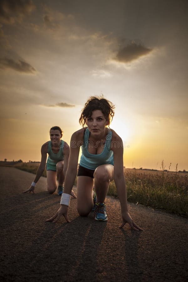 Two Pretty Girls Jogging in the Morning Stock Photo - Image of road ...
