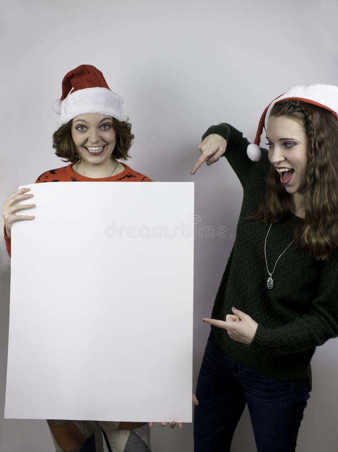 Two Pretty Woman Holding Sign Stock Photo - Image of caucasian, adult ...