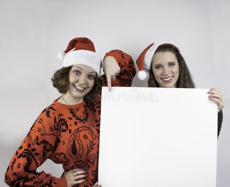 Two Pretty Women Holding Sign Stock Image - Image of females, female ...