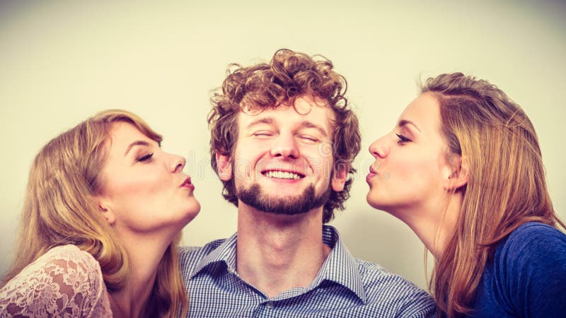 Two Pretty Women Kissing Handsome Man. Stock Image - Image of love ...