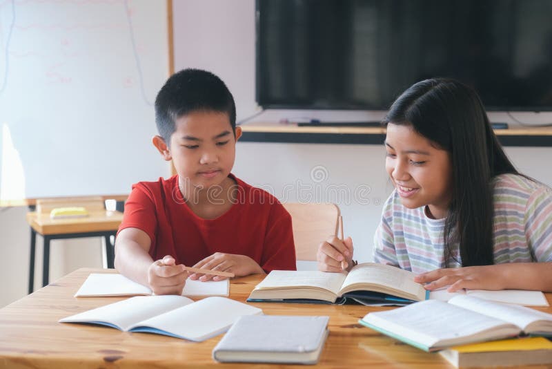 Two Primary School Kids Learning Together Stock Photo - Image of public ...
