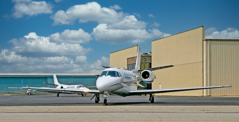 Two Private Jets by Hangers Stock Photo - Image of open, luxury: 33895242