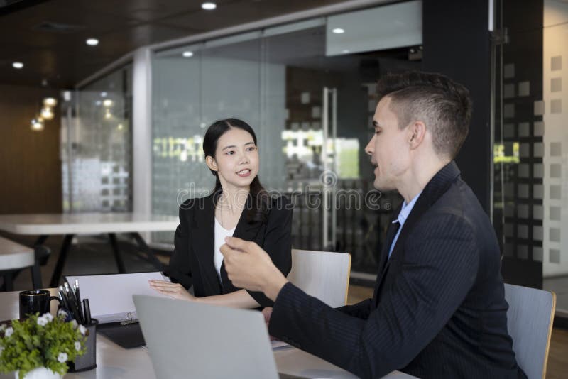 Two Professional Businesspeople Discussing Project Planning in Modern ...