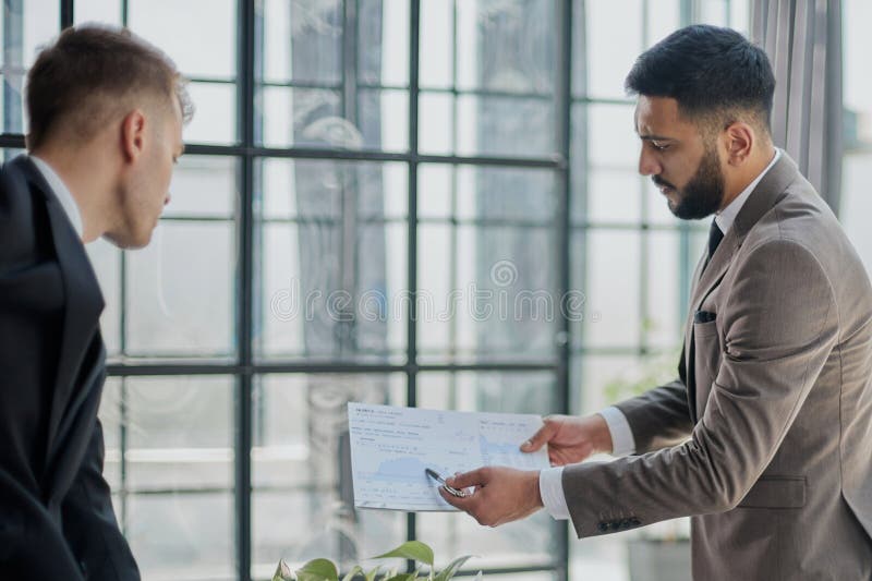 Two Professional Businessmen Discussing and Using Desktop Computer in ...