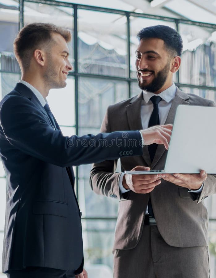 Two Professional Businessmen Discussing and Using Desktop Computer in ...