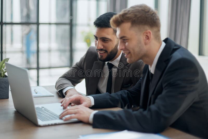 Two Professional Businessmen Discussing and Using Desktop Computer in ...