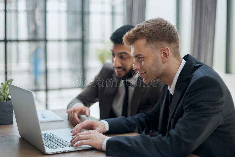 Two Professional Businessmen Discussing and Using Desktop Computer in ...