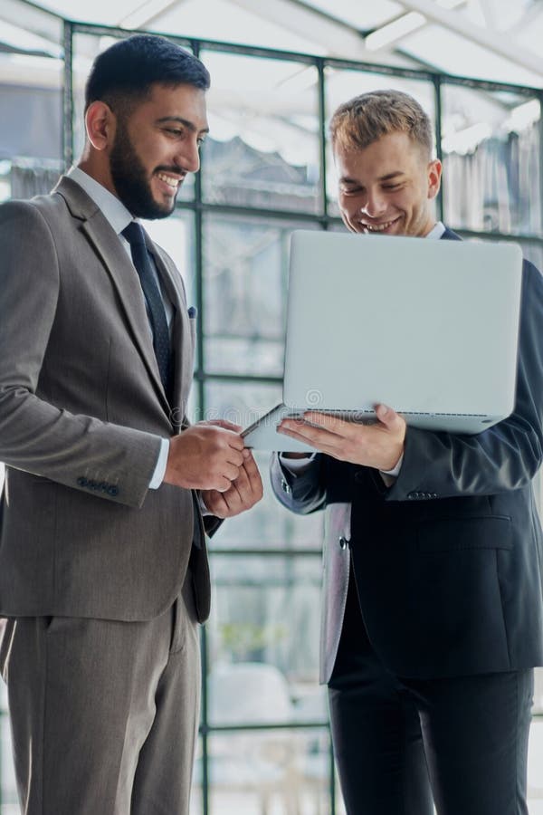 Two Professional Businessmen Discussing and Using Desktop Computer in ...