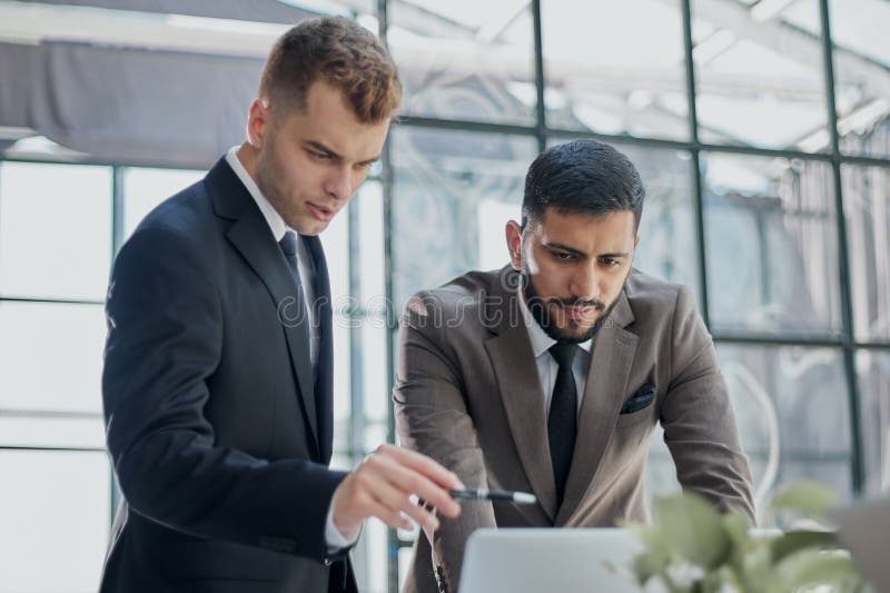 Two Professional Businessmen Discussing and Using Desktop Computer in ...