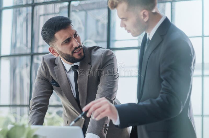 Two Professional Businessmen Discussing and Using Desktop Computer in ...