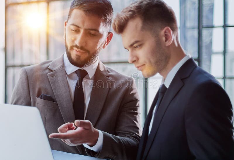 Two Professional Businessmen Discussing and Using Desktop Computer in ...