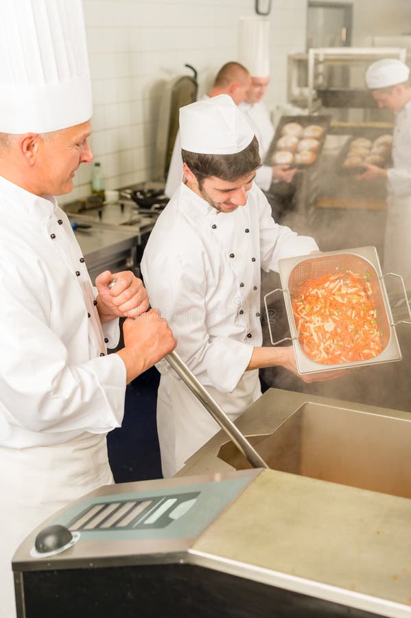 Two Professional Chefs Cooking in Kitchen Stock Image - Image of ...