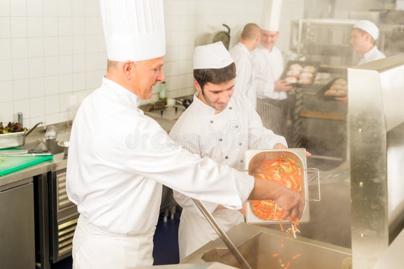 Professional Kitchen Smiling Chef Add Spice Food Stock Image - Image of ...