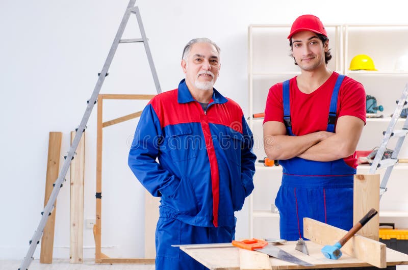 The Two Professional Contractors Laying Flooring at Home Stock Image ...