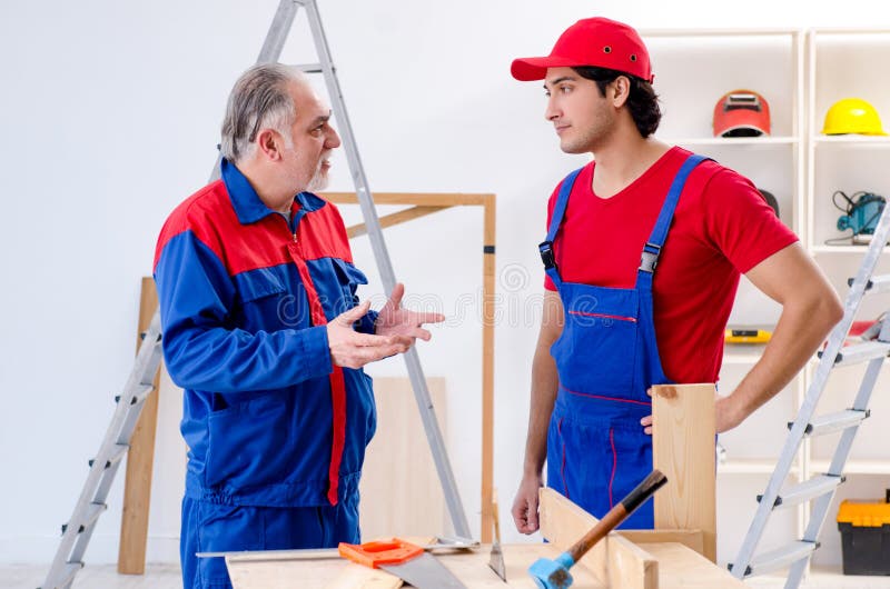 The Two Professional Contractors Laying Flooring at Home Stock Image ...