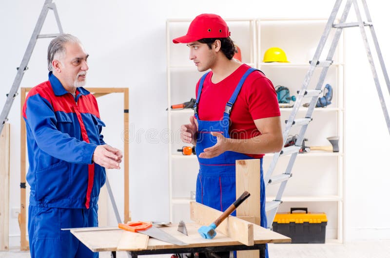 The Two Professional Contractors Laying Flooring at Home Stock Image ...