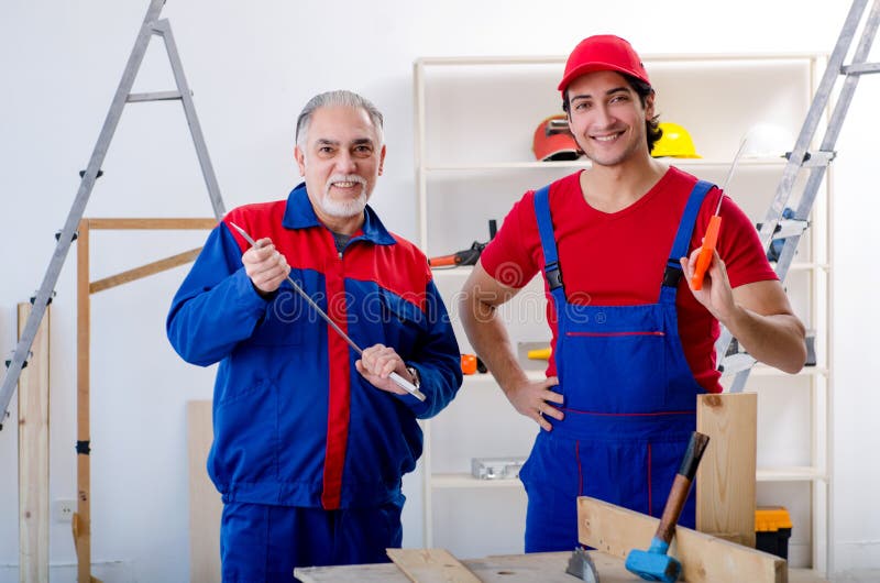 The Two Professional Contractors Laying Flooring at Home Stock Image ...