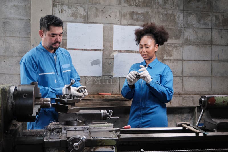 Two Professional Engineering Workers Work in a Metalwork Manufacturing ...