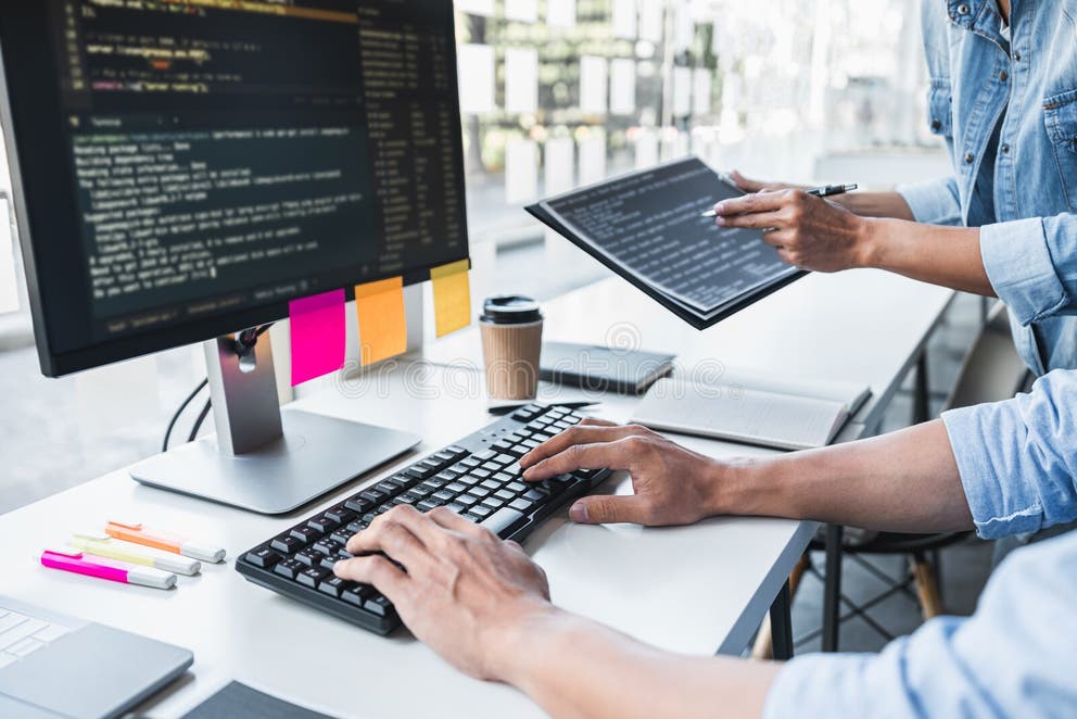 Two Professional Programmer Cooperating and Working on Web Site Project in a Software Developing ...