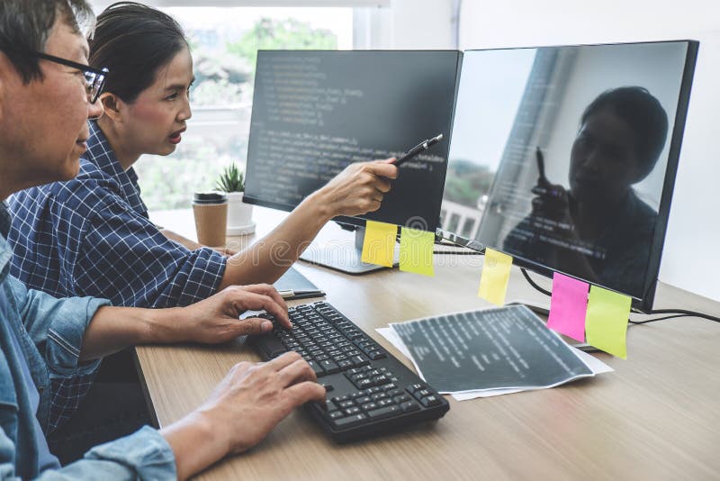 Two Professional Programmers Cooperating At Developing Programming And Website Working In A
