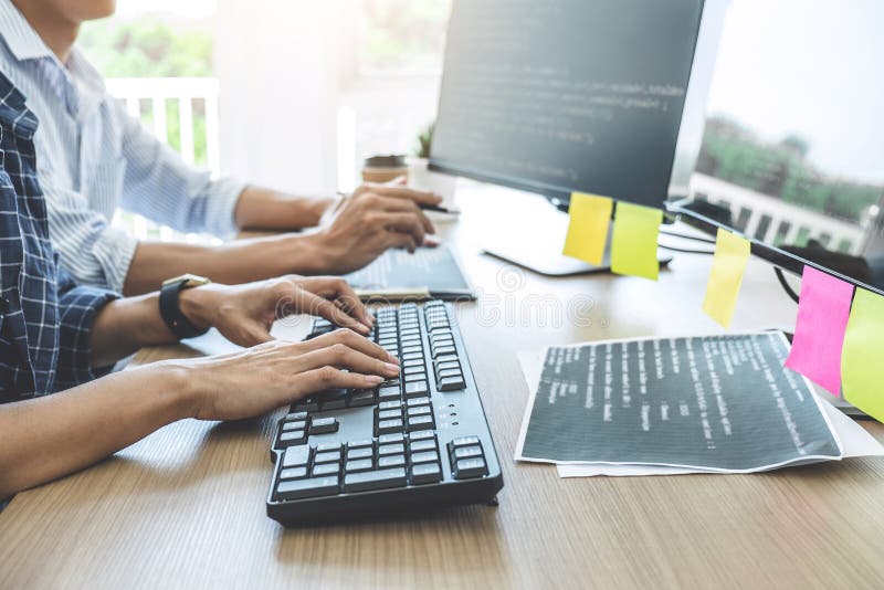 Two Professional Programmers Cooperating At Developing Programming And Website Working In A