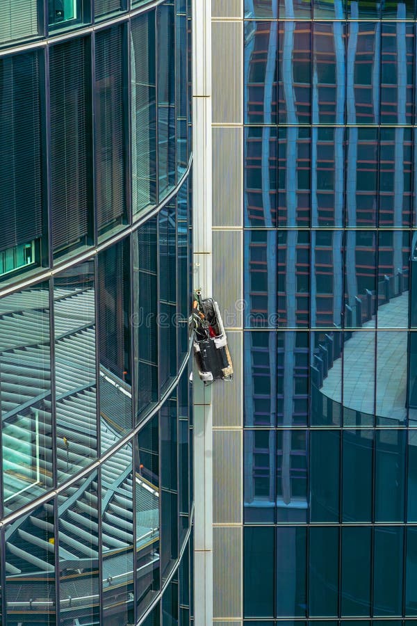Two Professional Skyscraper Cleaning and Maintenance Workers, Inside a ...