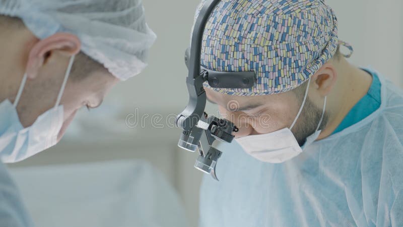 Two Professional Surgeons on Operation. Action. Surgeons Calmly and ...