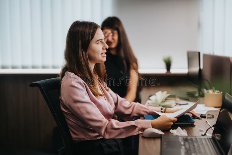 Two Professional Women Engaging in a Productive Business Meeting at the ...