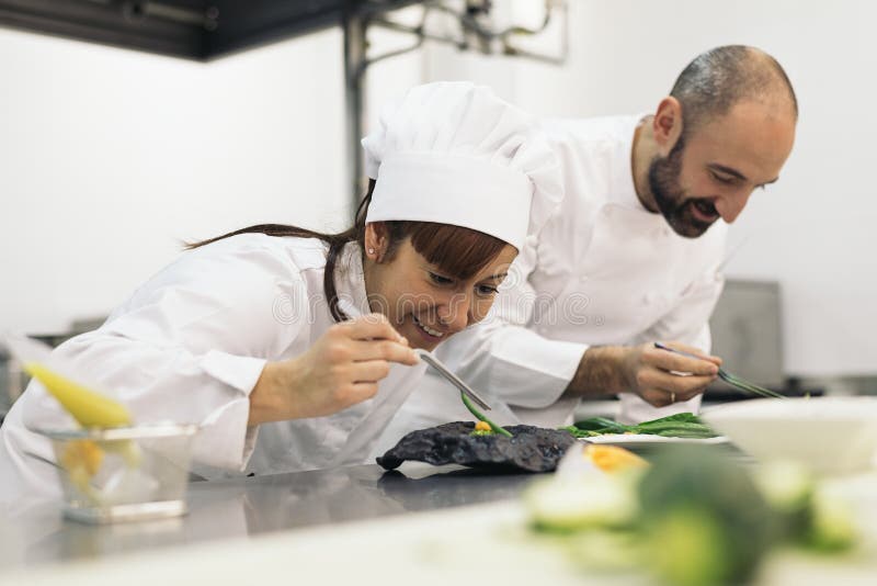 Two Professionals Chefs Cooking Together. Stock Photo - Image of happy ...