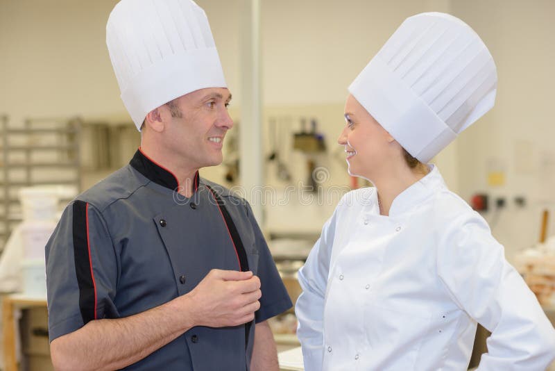 Two Professionals Chefs Talking and Smiling in Kitchen Stock Photo ...
