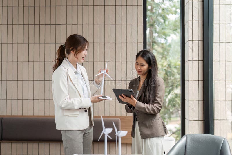 Renewable Energy Solutions. Two Women Discussing Sustainable Energy ...