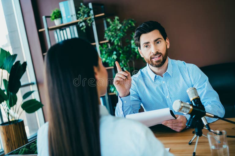 Two Professionals Collaborating in a Modern Workspace during an ...