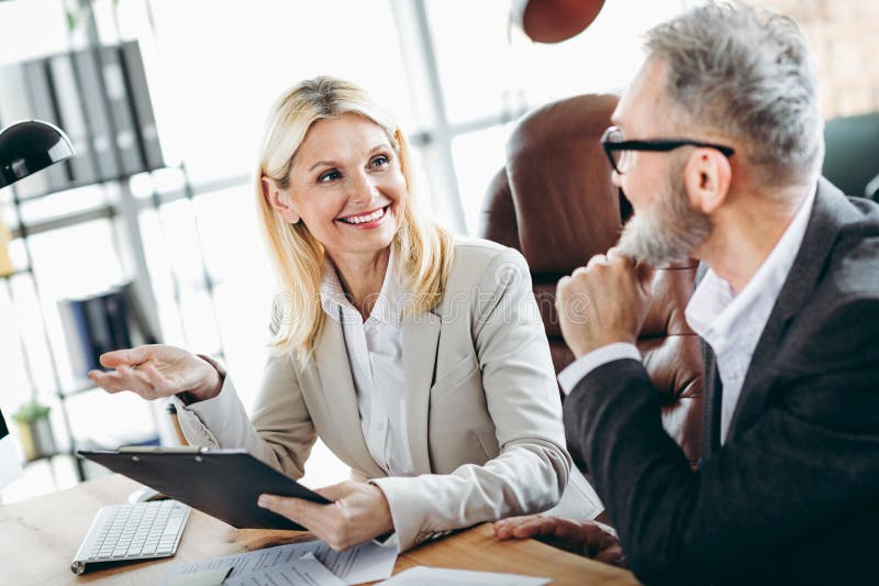 Friendly Coworkers Having a Productive Discussion in a Modern Office ...