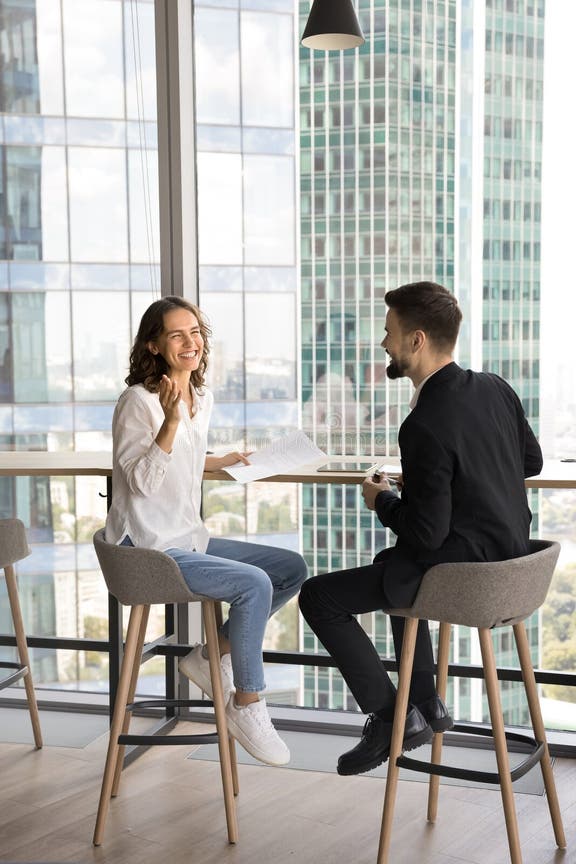 Two Professionals Having Conversation in Modern Office Stock Photo ...