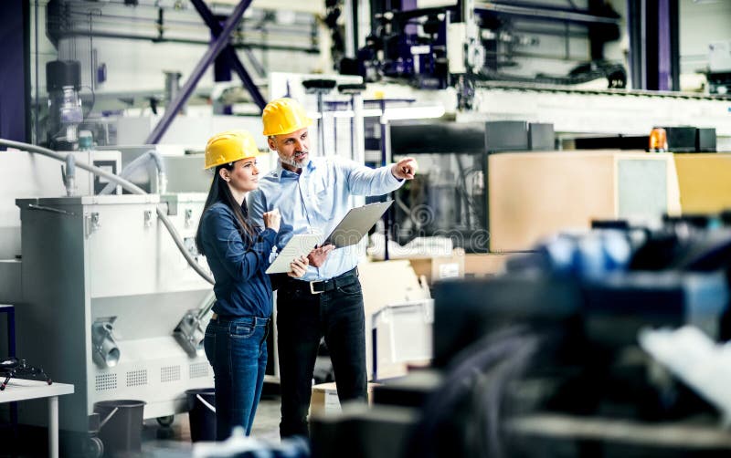 Two Project Managers Standing in Modern Industrial Factory ...