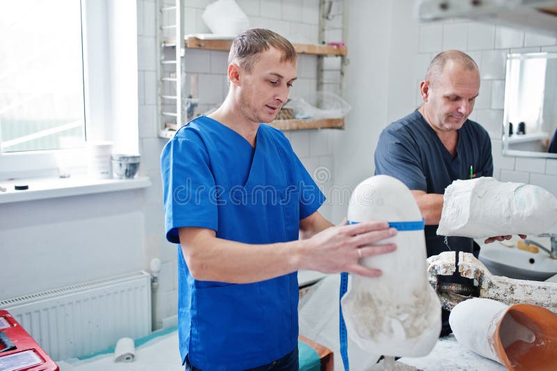 Prosthetist man worker stock photo. Image of medic, holding - 212181546
