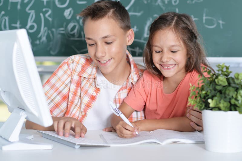 Two Pupils Working Together Stock Image - Image of programming, girl ...
