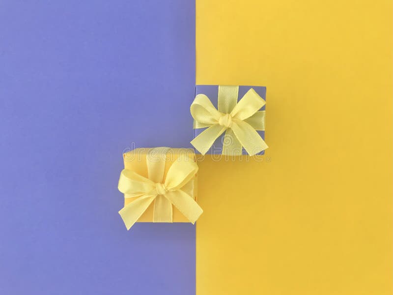Two Purple Gift Boxes on Yellow and Purple Background. Stock Photo ...