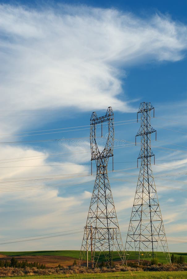 Two Pylons at Sunset stock photo. Image of energy, utility - 19564536