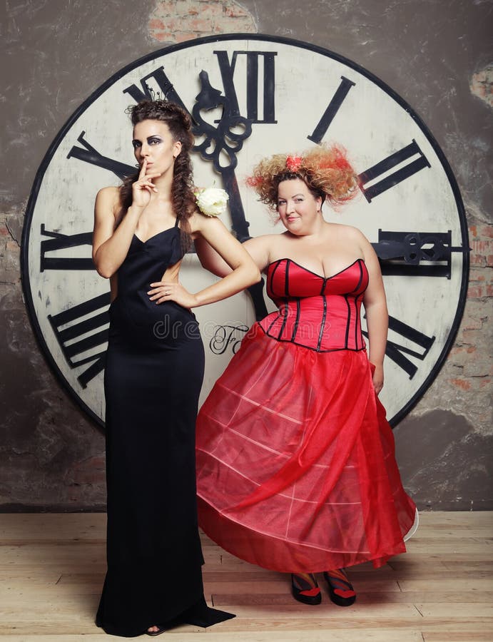 Two Queens Posing Next To the Clock. Stock Image - Image of elegant ...
