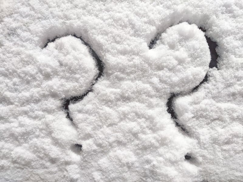 Two Question Marks Written in the Snow. the Cold Frosty Texture of the ...