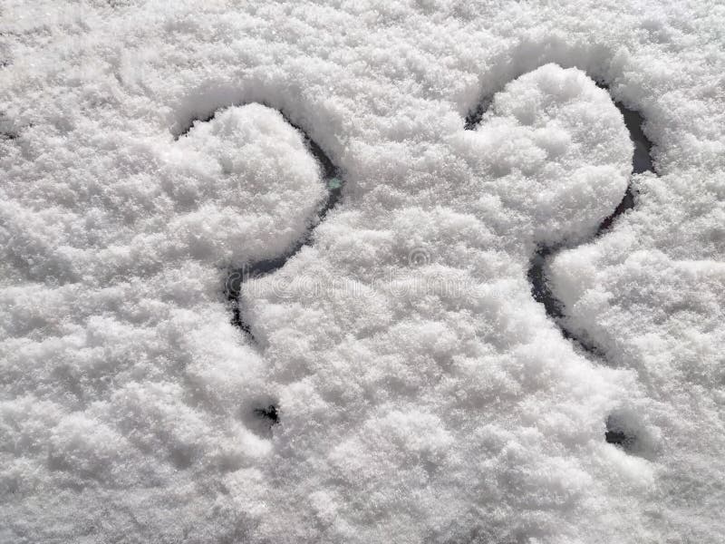 Two Question Marks Written in the Snow. the Cold Frosty Texture of the ...
