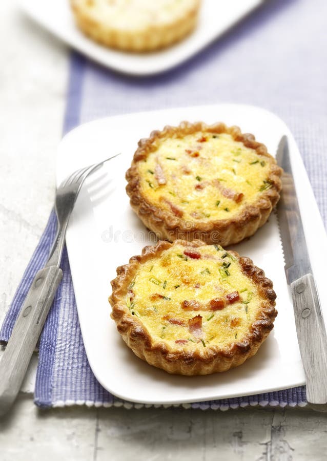 Two Quiches with Bacon on a Plate Stock Image - Image of dish, culinary ...