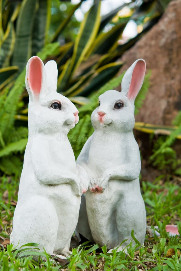The Two Rabbit Dolls in the Garden Stock Photo - Image of rock ...