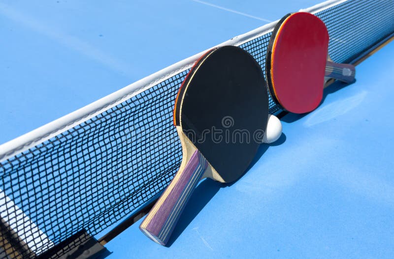 Two Rackets for Ping-pong on a Blue Table. Stock Photo - Image of game ...