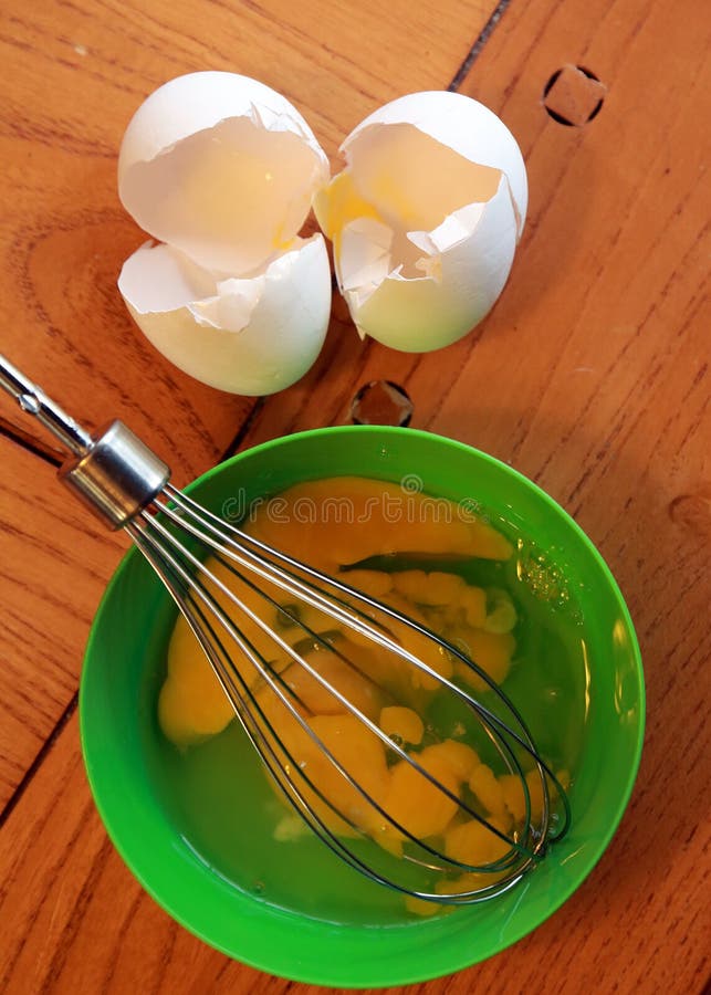 Raw eggs, shells and whisk stock image. Image of cooking - 112535637