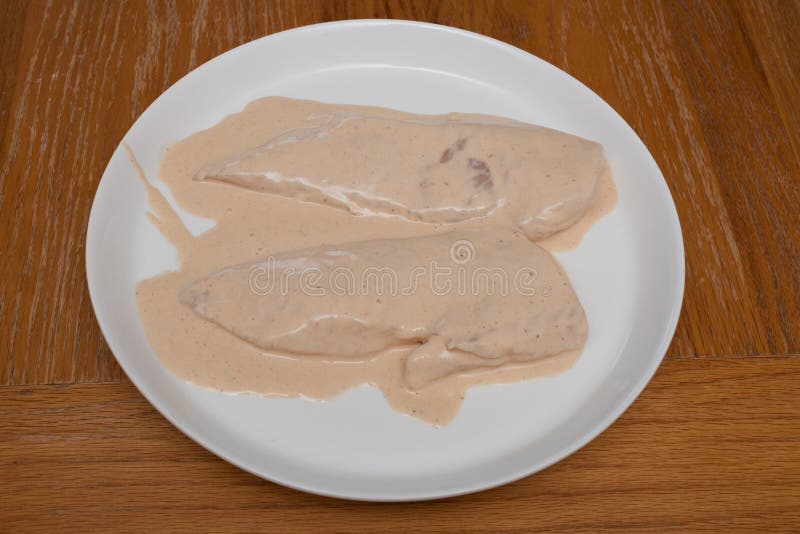 Two Raw Haddock Fillets Covered in Beer Batter for Deep Frying Stock ...