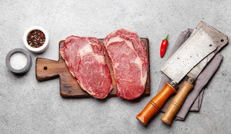 Two raw ribeye beef steaks stock photo. Image of beef - 254208860