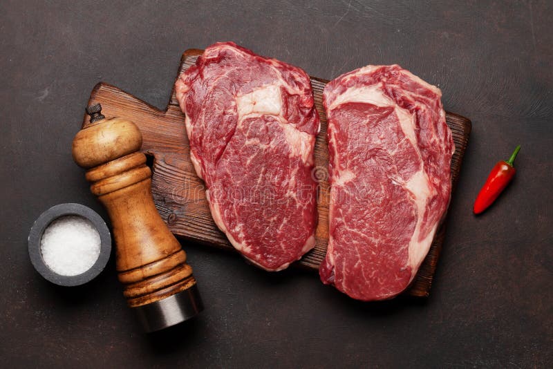 Two raw ribeye beef steaks stock image. Image of steak - 255840311