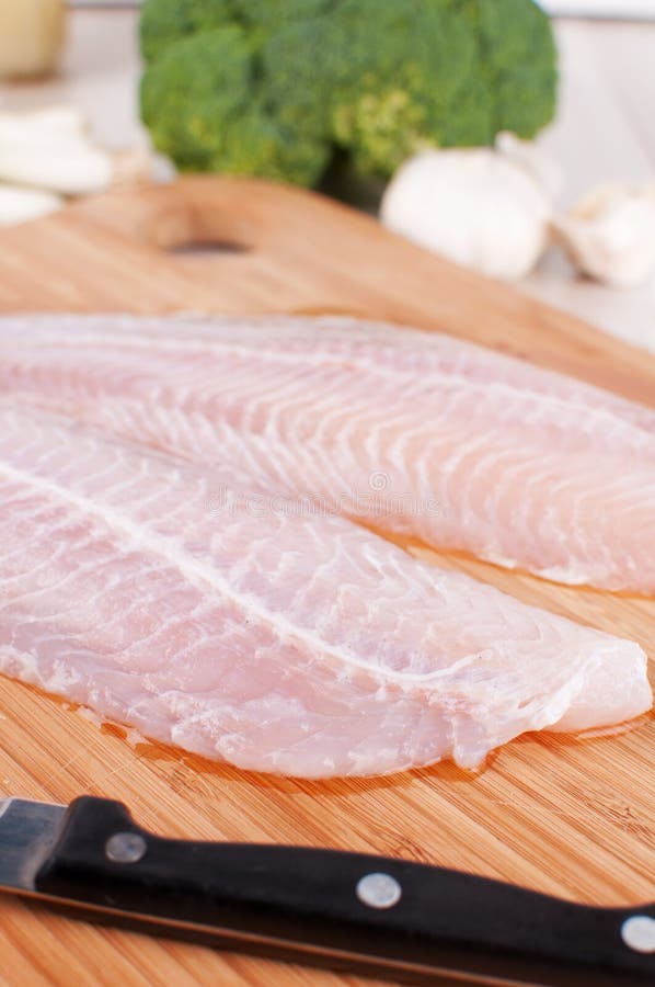 Two Raw White Fish Fillet and Knife Stock Photo - Image of hake ...